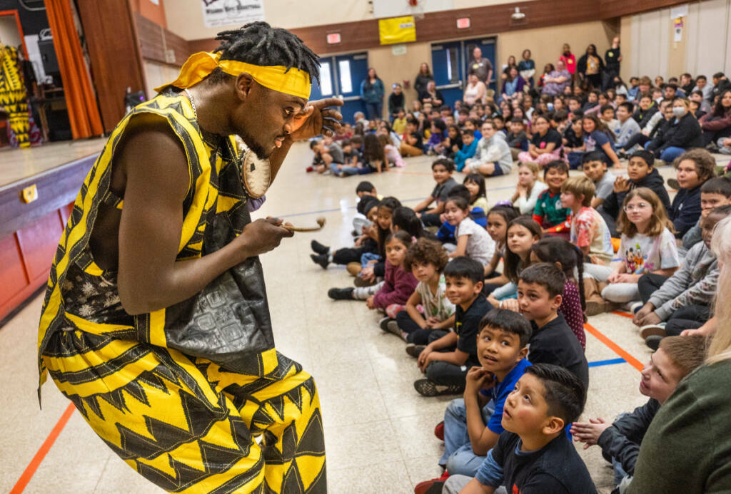 aly guisse uses his drum to communicate with students during a ...